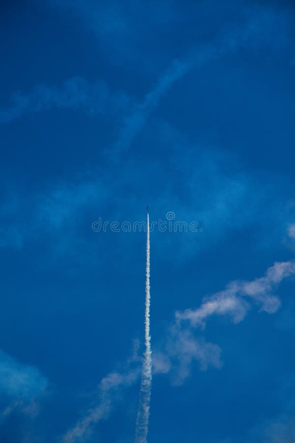 Vertical Shot of Contrail Plain with a Line-shaped Cloud Formation on ...
