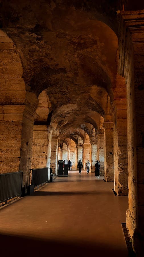 Vertical Shot of a Corridor Inside an Ancient Building with Arches ...