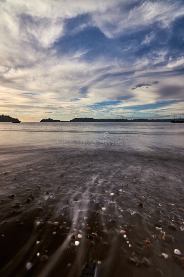 Vertical Shot of a Costa Rica Beach Under a Cloudy Sky Stock Image ...