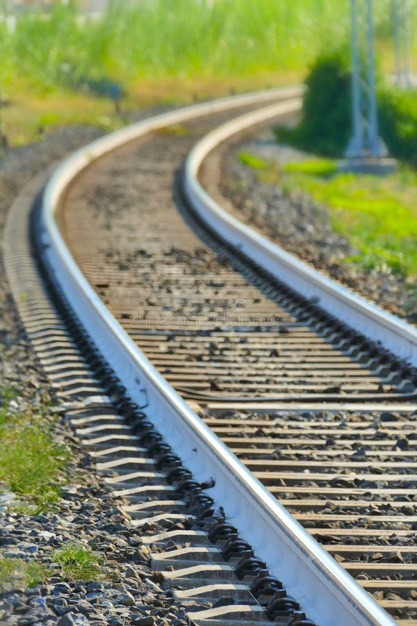 Vertical Shot of a Curve and Narrow Railroad Track Stock Photo - Image ...