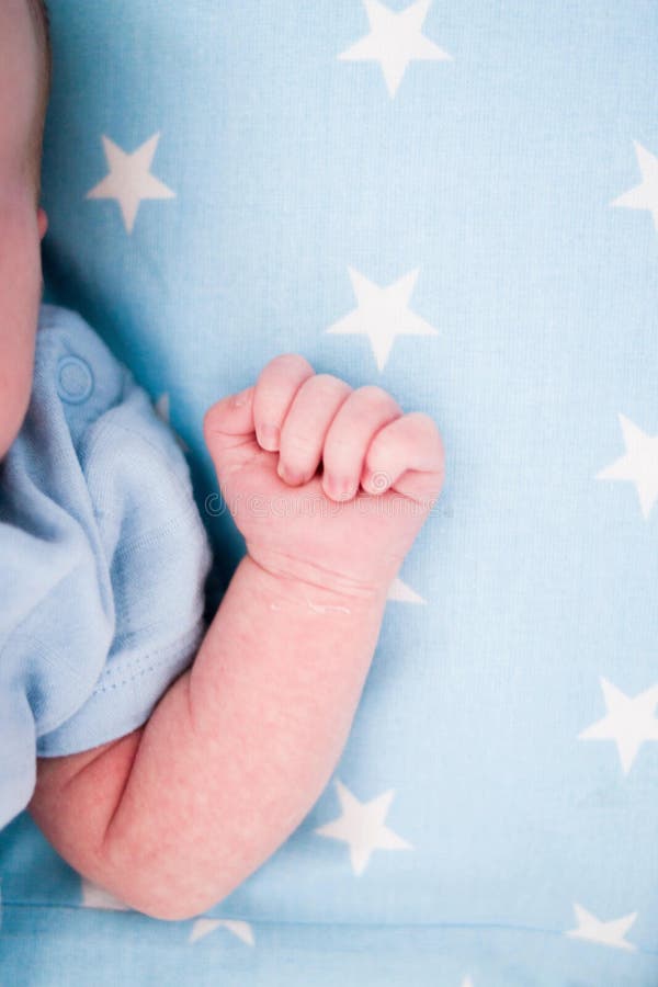 Vertical Shot of a Cute Baby on a Blue Blanket with White Stars Stock ...