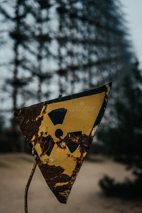 Vertical Shot of a Damaged Yellow Danger Sign Outdoors Stock Image ...