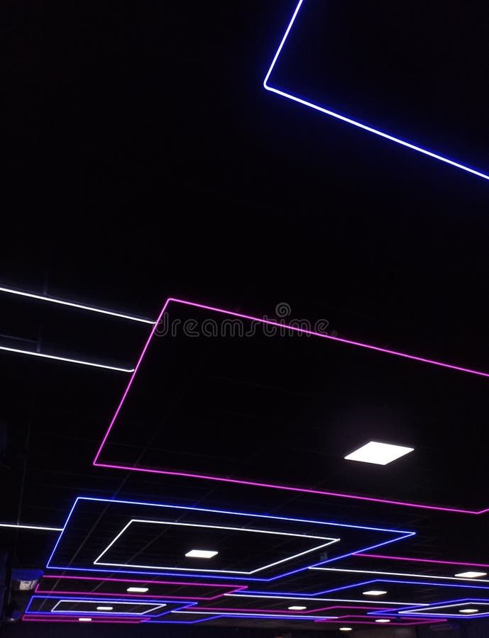 Vertical Shot of a Dark Ceiling with Bright Neon Lights on it Stock ...