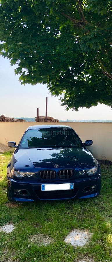 Vertical Shot of a Dark Metallic Blue BMW M3 E46. Stock Image - Image ...