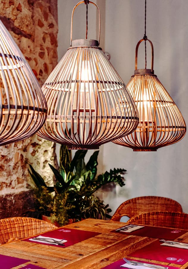 Vertical Shot of Decorative Lamps Above a Table Indoors Stock Photo ...