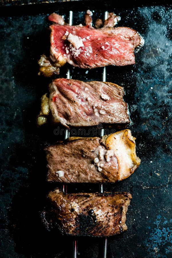 Vertical Shot of Delicious Meat in the Process of Making a Barbecue ...
