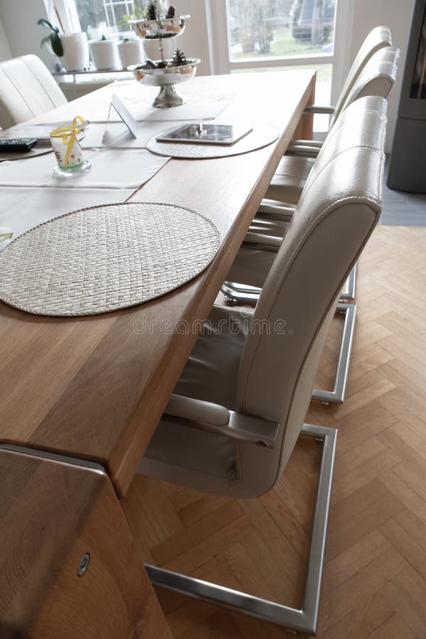 Vertical Shot of a Dining Room Brown Table with Brown Chairs Stock ...