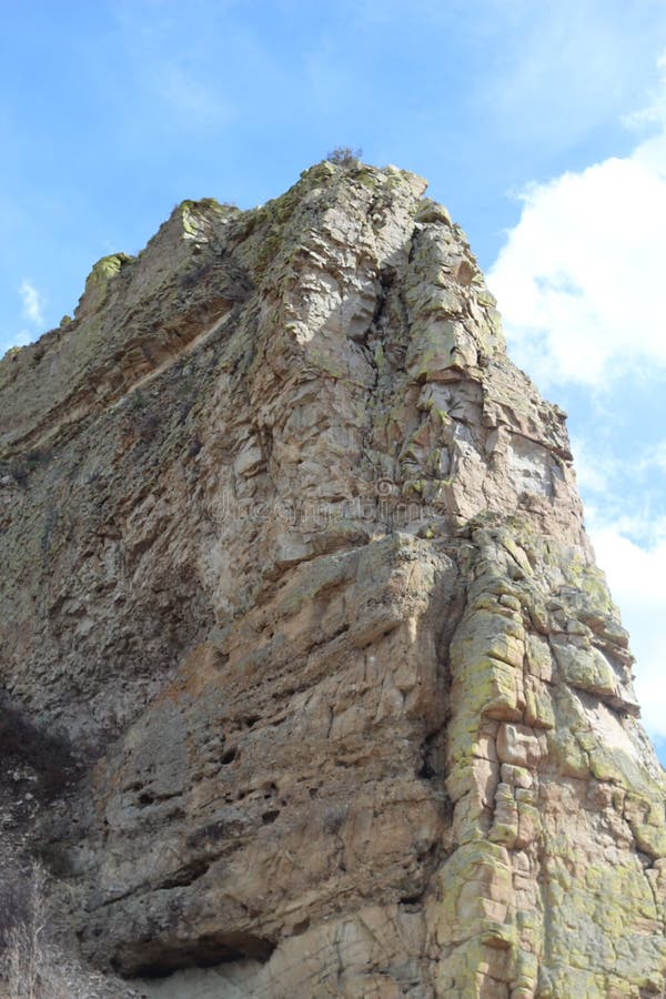 Vertical Shot of Edge of Cliff Under Blue Bright Sky Stock Photo ...