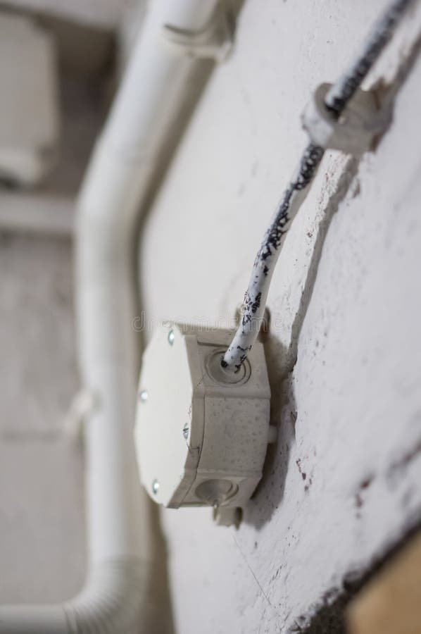 Vertical Shot of an Electric Cable on a Wall Stock Image - Image of ...