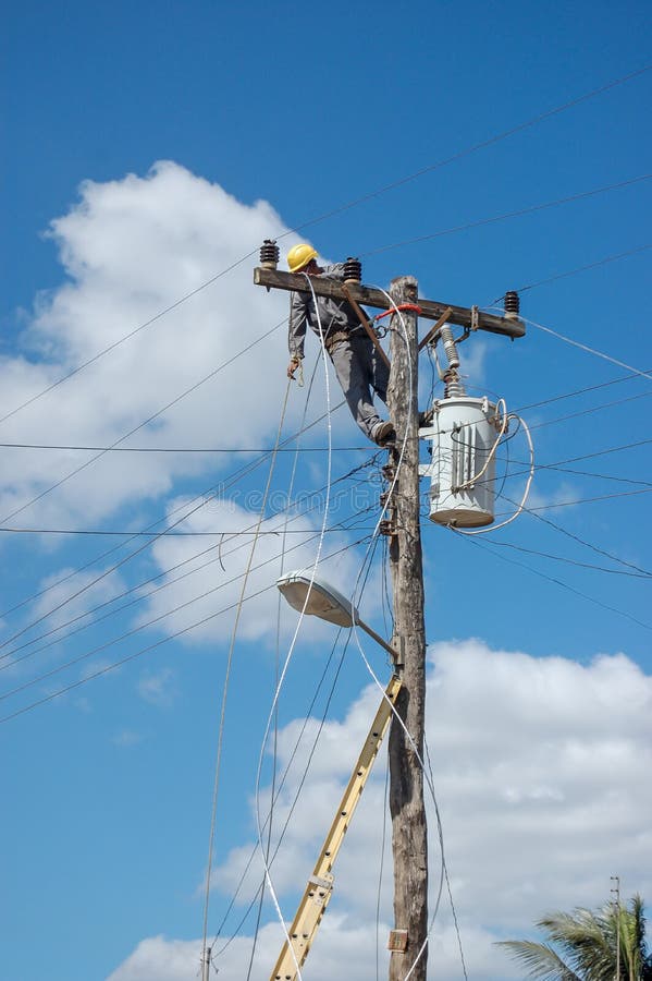 Vertical Shot of Electric Lineman Working on Pole Stock Photo - Image ...