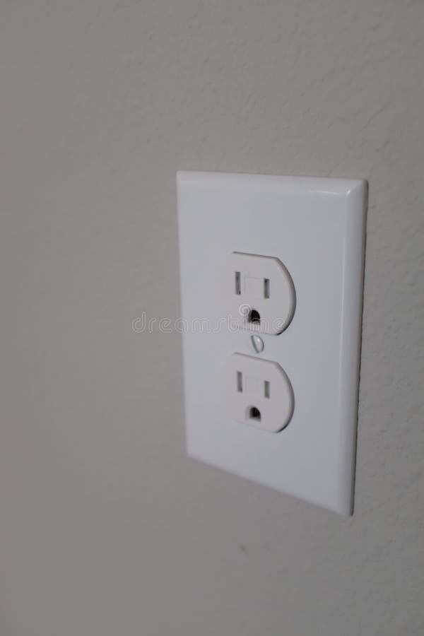 Vertical Shot of an Electric Plug -- Side View on the Wall Stock Photo ...