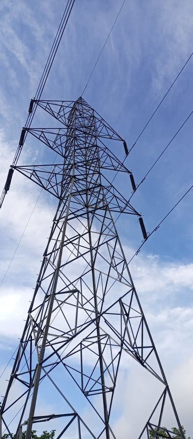 Vertical Shot of an Electric Tower High Voltage Post with Blue Sky ...