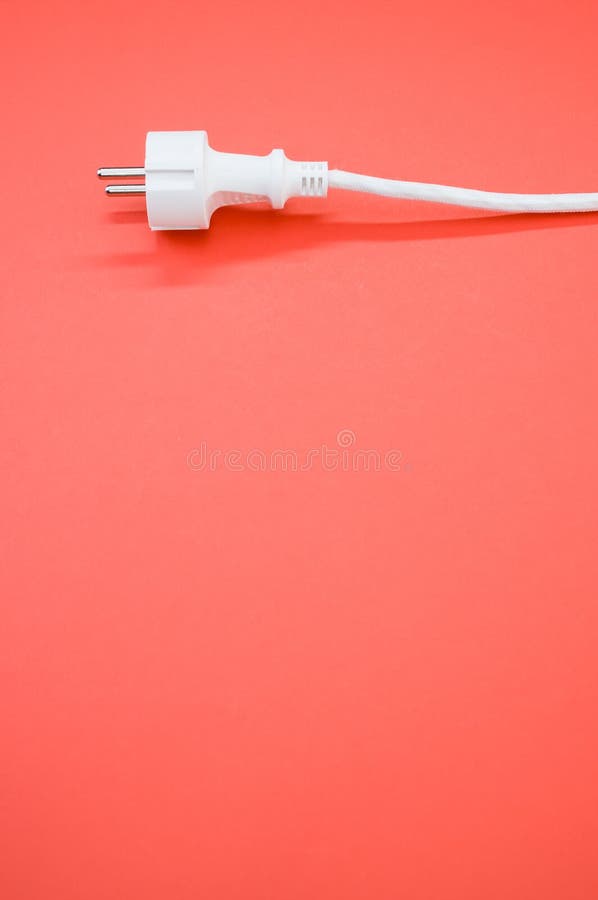 Vertical Shot of an Electrical Wire and Plug on a Pink Surface Stock ...