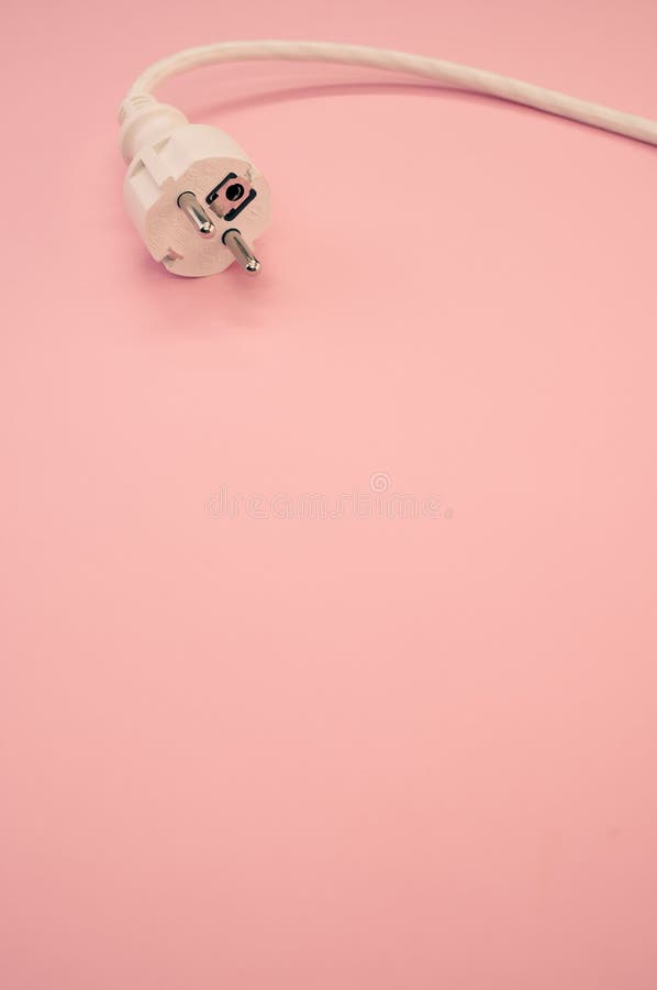 Vertical Shot of an Electrical Wire and Plug on a Pink Surface Stock ...