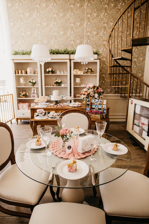 Vertical Shot of an Elegant Beautiful Cafe with a Table Decorated for a ...