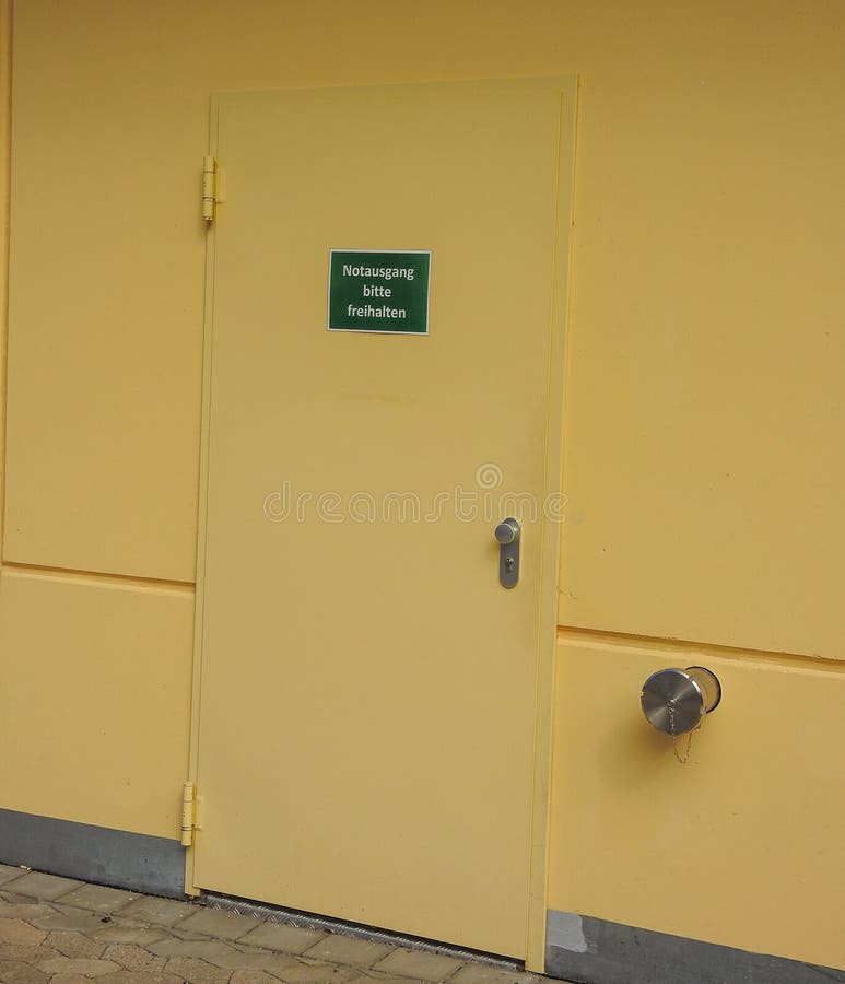 Vertical Shot of an Emergency Exit Sign in the German Language on a ...