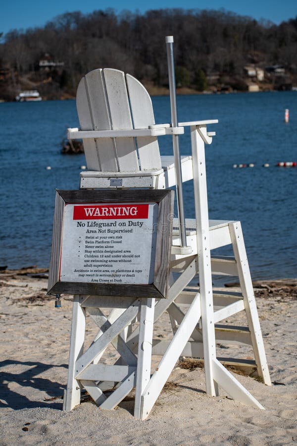 Vertical of a Warning Sign of Railroad Crossing Against Flowers Shot in ...