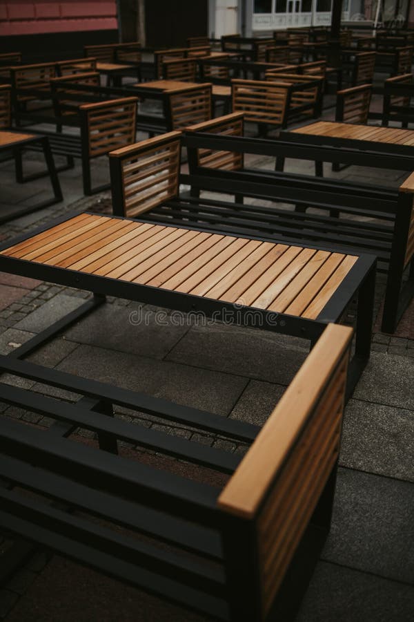 Vertical Shot of Empty Cafe Tables and Benches Outdoors Stock Photo ...