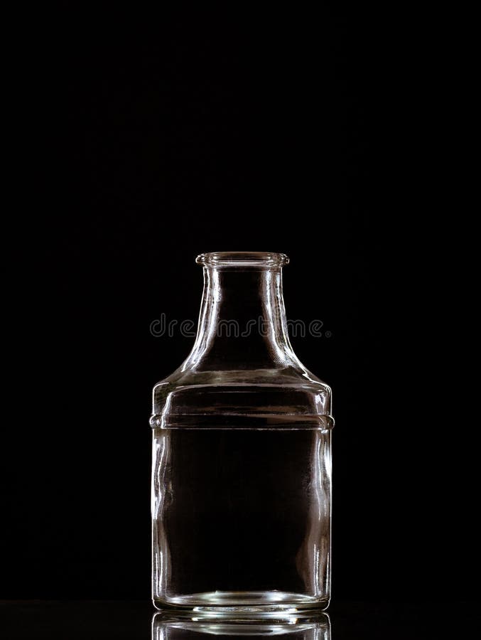 Vertical Shot of an Empty Decanter Isolated on a Black Background Stock ...