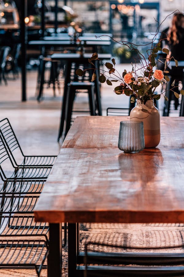 Vertical Shot of an Empty Restaurant Table with a Flower Vase Stock ...