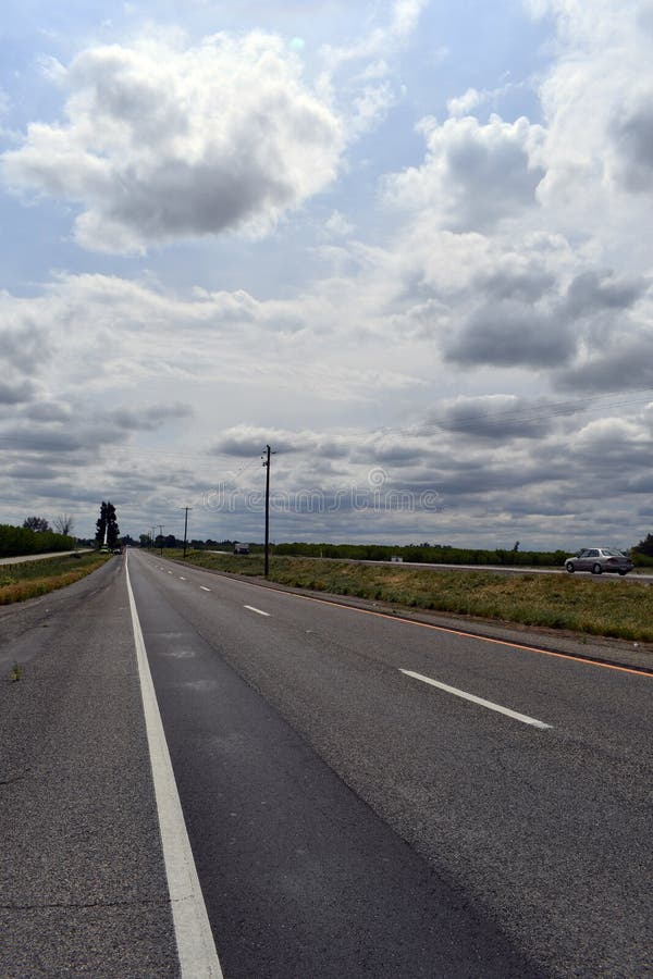 Vertical Shot of an Empty Road during Daytime Stock Image - Image of ...