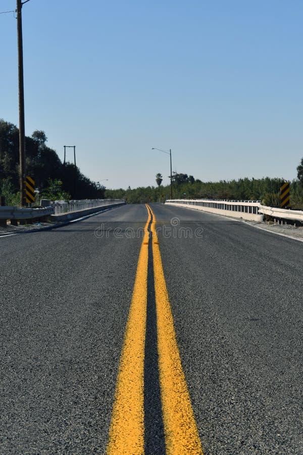 Vertical Shot of an Empty Road during Daytime Stock Image - Image of ...