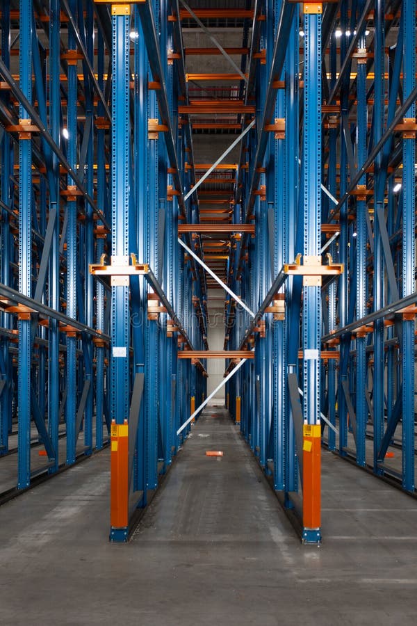 Vertical Shot of Empty Storage Racks in a Warehouse Stock Photo - Image ...