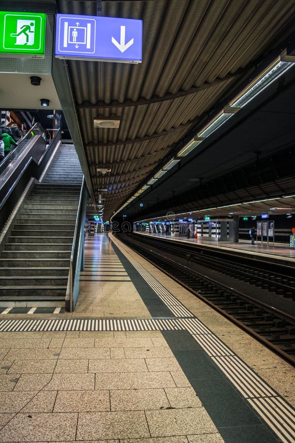 Vertical Shot of the Exit Sign Near the Escalator at a Metro Station at ...
