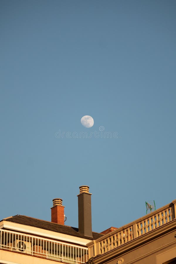 Vertical Shot F a Moon Over the Building Stock Photo - Image of heaven ...