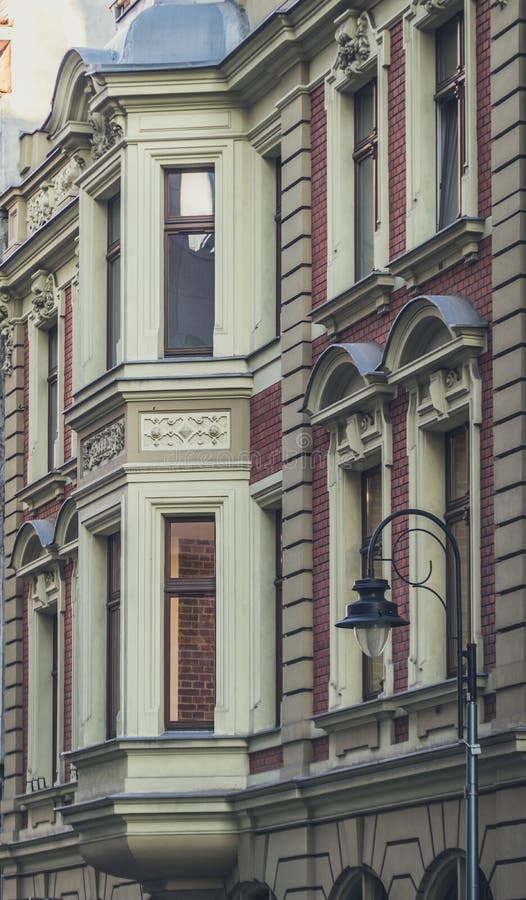 Vertical Shot of the Facade and Windows of a Building on the Side of a ...