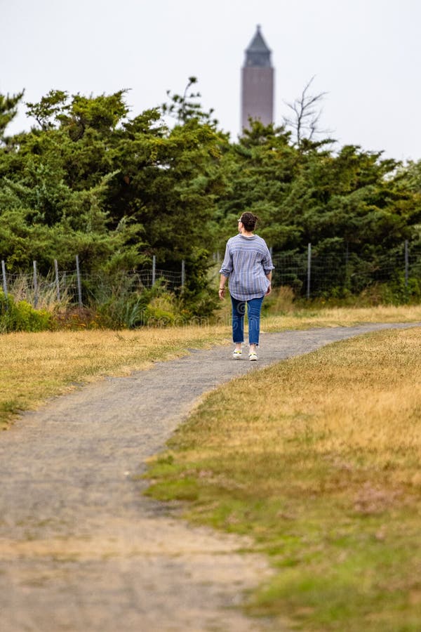 Vertical Shot of a Female Walking in the Park Stock Image - Image of ...