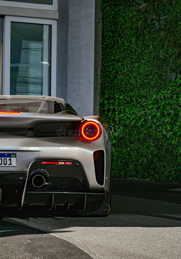 Vertical Shot of a Ferrari 488 GTB with Red Brake Lights on Outdoors in ...