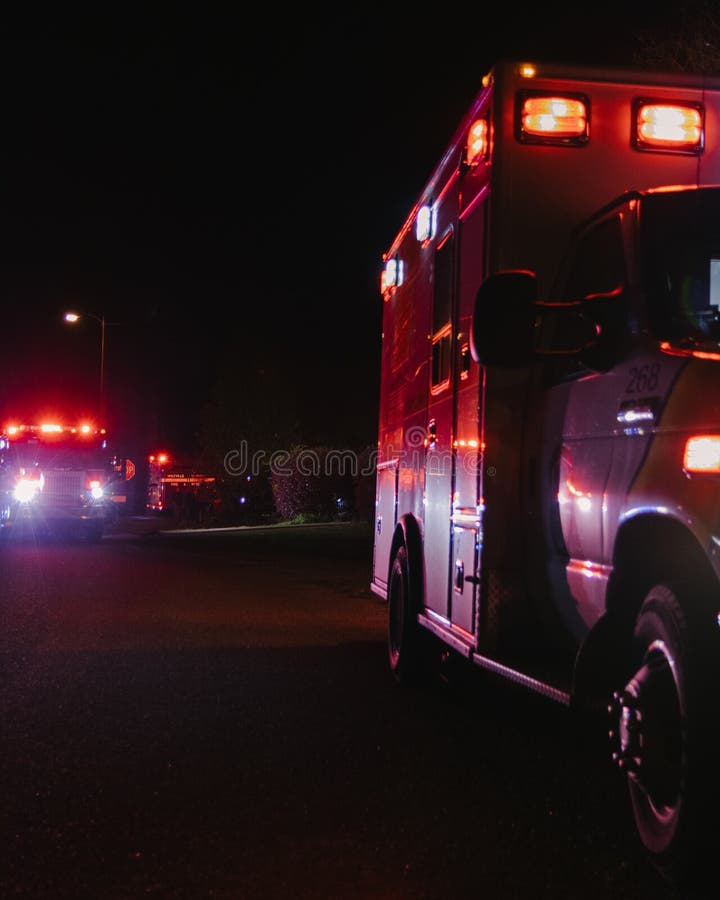 Vertical Shot of Fire Engines at Night Stock Photo - Image of glowing ...