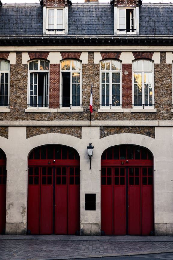 Vertical Shot of a Fire Station with Red Gates Stock Photo - Image of ...