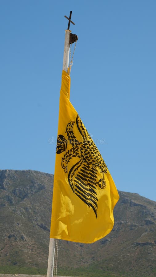 Vertical Shot of the Flag of Mount Athos Captured during the Daytime in ...