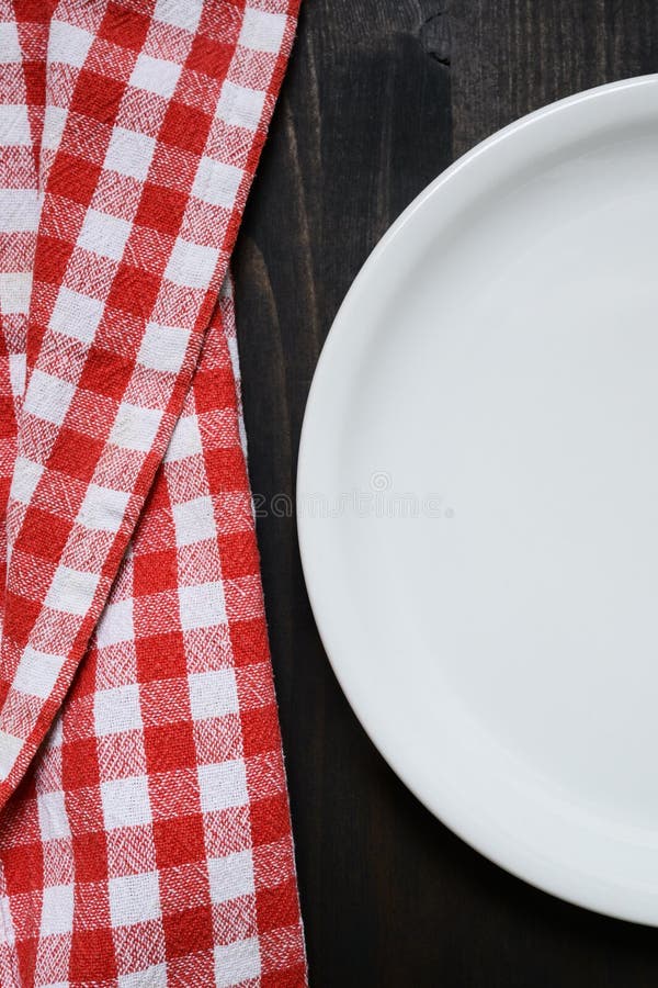 Vertical Shot of Flat White Dinner Plate on Kitchen Table Stock Photo ...