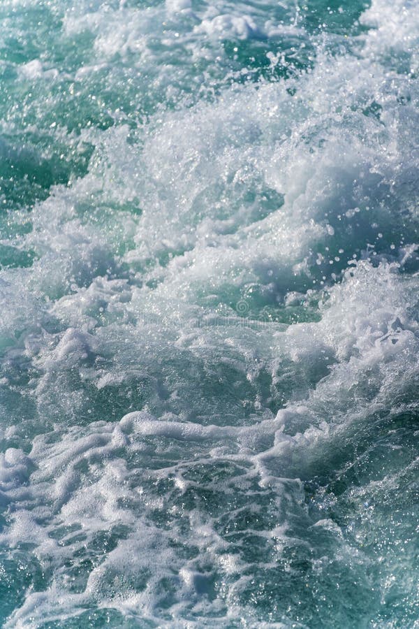 Vertical Shot of a Foamy Splash of the Sea - for Wallpapers Stock Photo ...