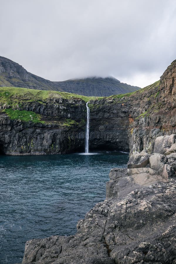 Vertical Shot of the Fossa Waterfall in the Faroe Islands Stock Image ...