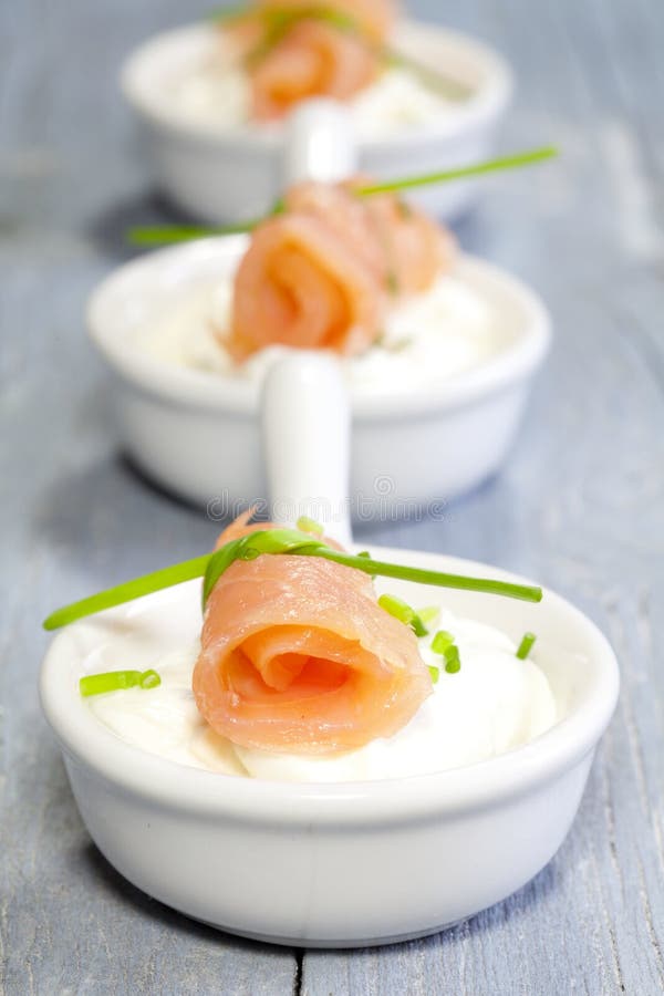 Vertical Shot of Fresh Salmon with Sauce on Small White Dishes Stock ...