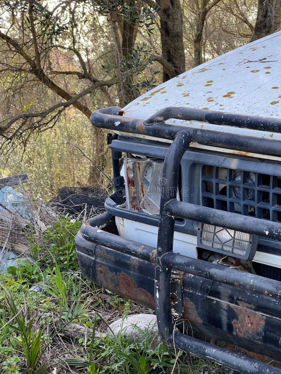 Vertical Shot of the Front Bumper of an Old and Rusty White Car Found ...