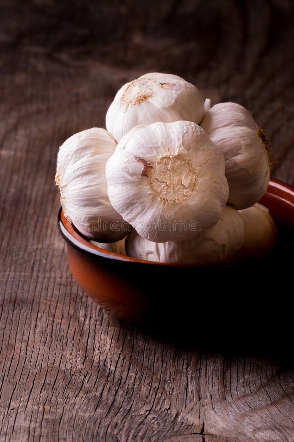 Vertical Shot of Garlics in a Clay Pot Stock Image - Image of clove ...