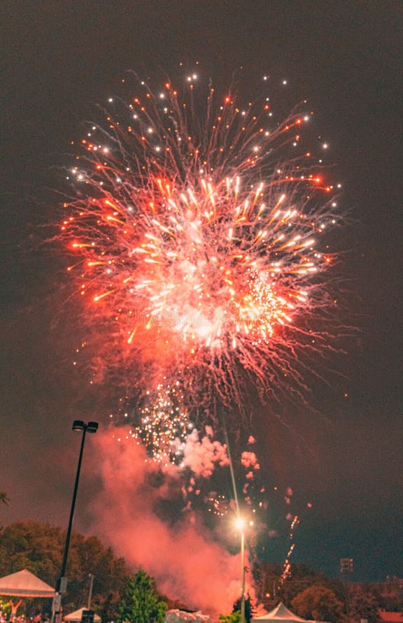 Vertical Shot of a Glowing Firework in the Sky at Night Stock Photo ...