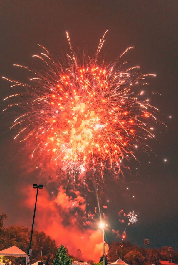 Vertical Shot of a Glowing Firework in the Sky at Night Stock Photo ...