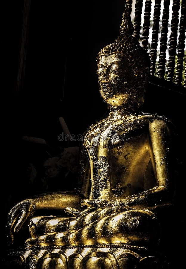 Vertical Shot of a Golden Buddha Statue Inside a Temple with the ...