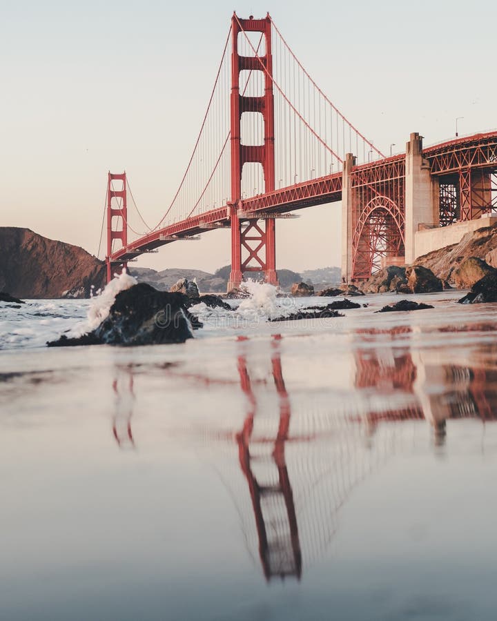 Vertical Shot of the Golden Gate Bridge Under a Cloudy Sky Stock Image ...