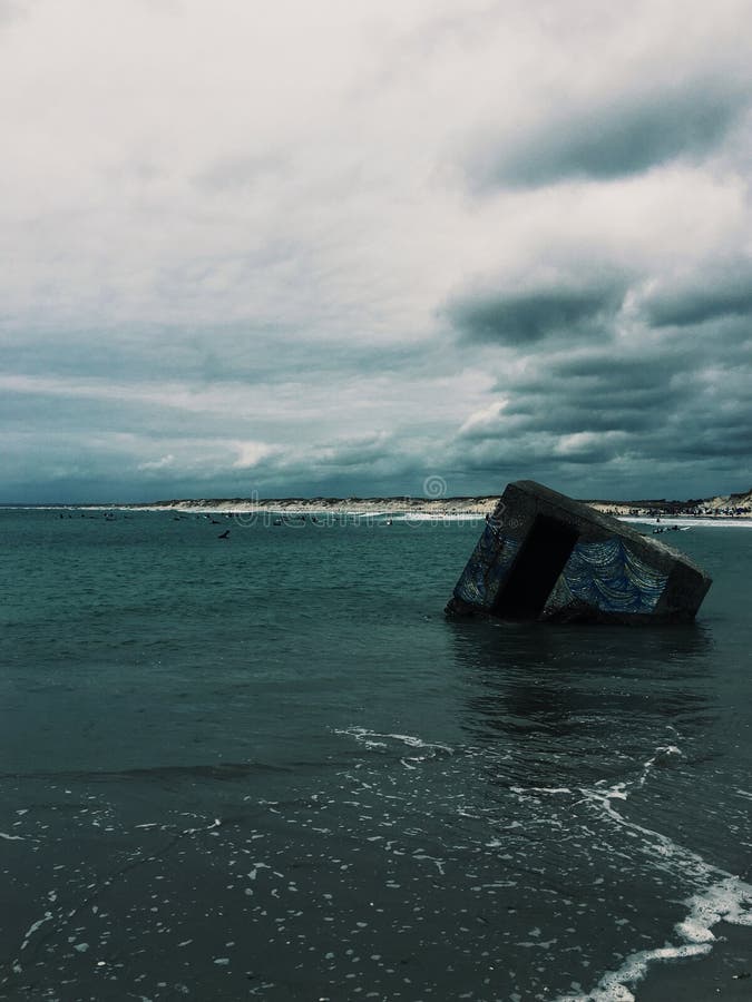 Vertical Shot of a Gray Square Object Floating on the Body of Water ...