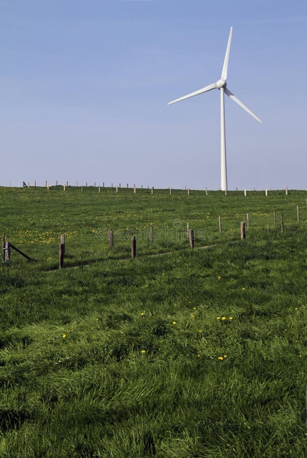 Vertical Shot of a Green Field with Wind Turbine Stock Image - Image of ...