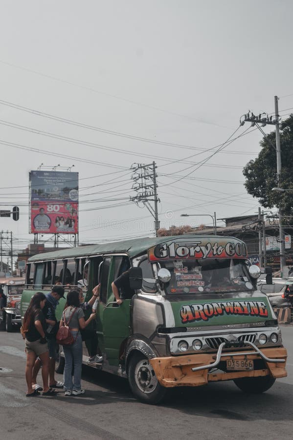 Vertical Shot of a Group of Local People Getting on an Old Minibus in ...