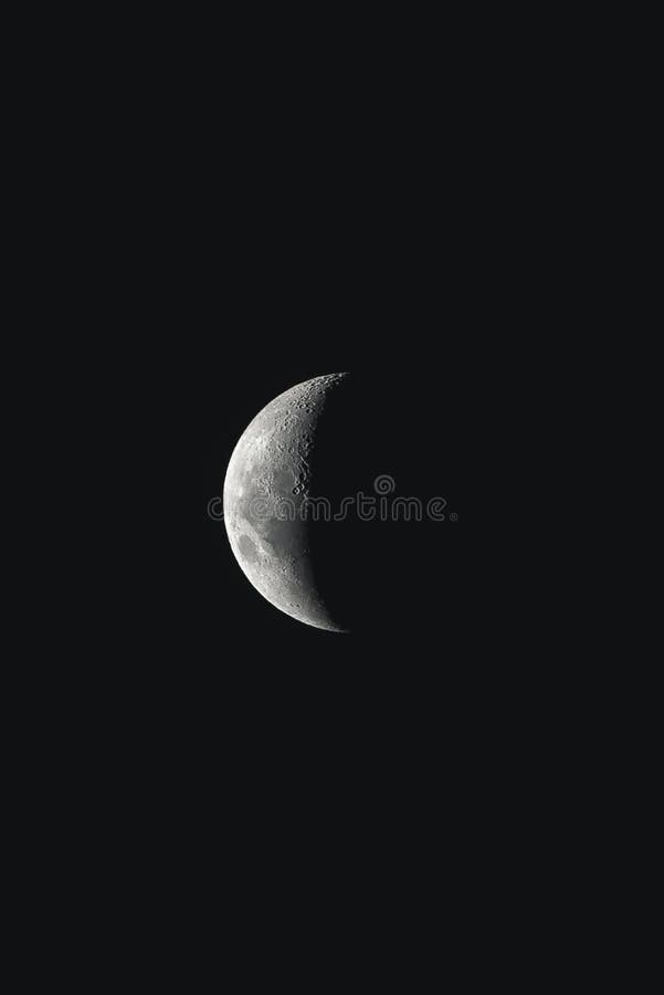 Vertical Shot of the Half-moon Isolated in the Dark Sky Stock Photo ...