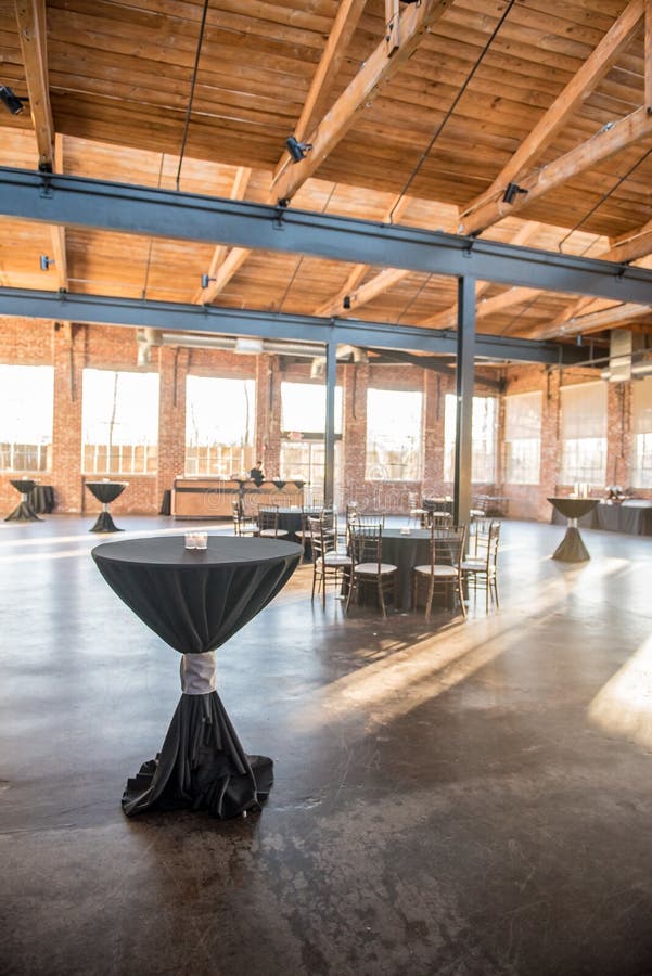 Vertical Shot of a Hall with a Few Tall Tables Stock Image - Image of ...